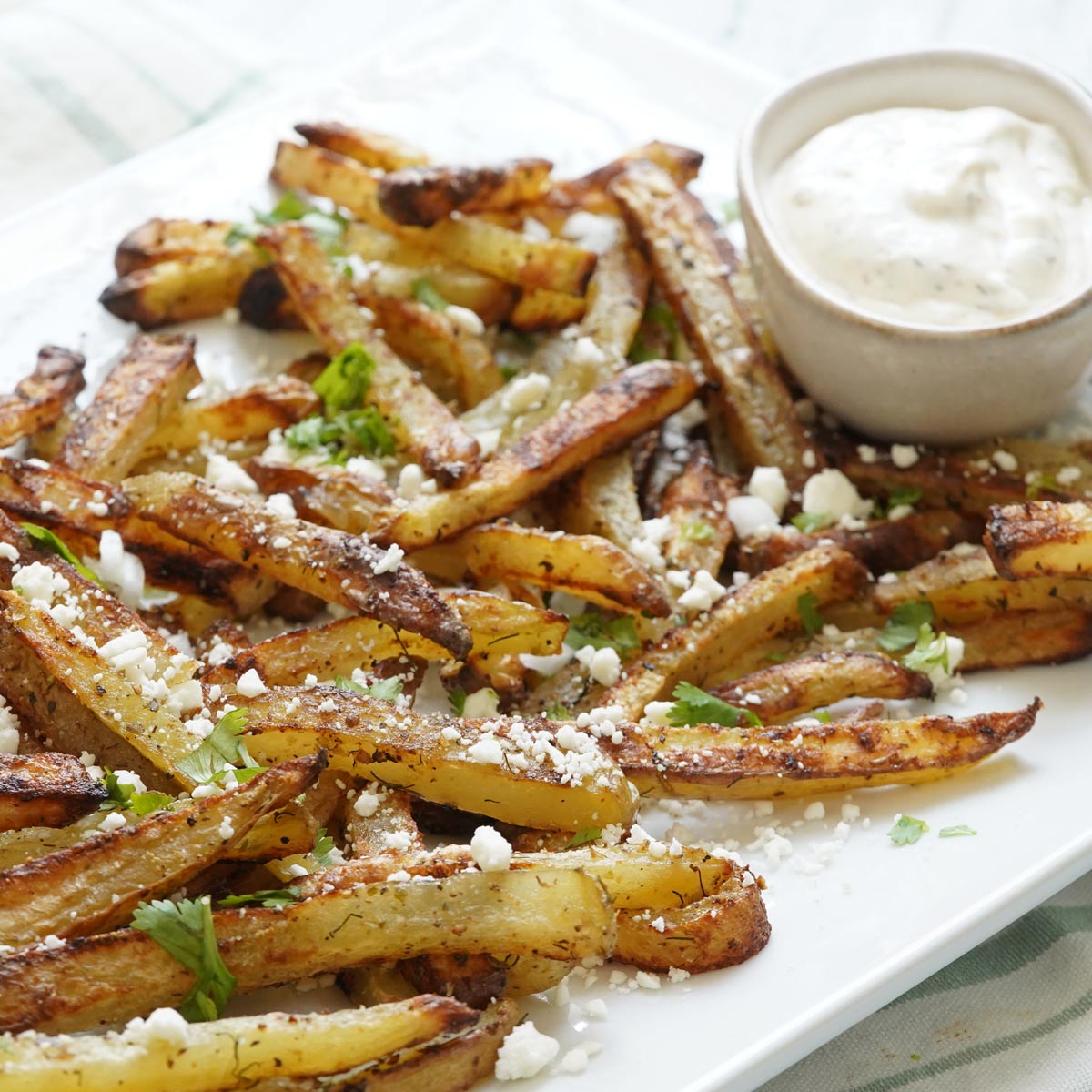 Seasoned Greek Fries with Lemon Dill Sauce - A Food Lover's Kitchen